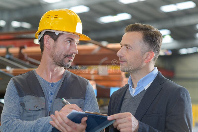 Construction Managers Talking about Project Stock Image - Image of ...