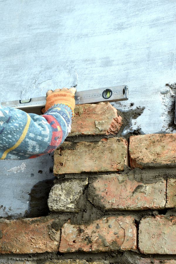Construction mason at work stock photo. Image of people - 142183818