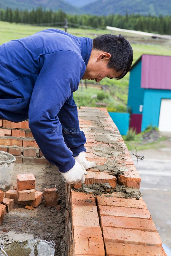 Construction Mason Worker Bricklayer Installing Brick Stock Photo ...