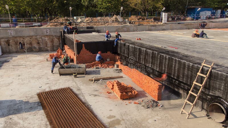 A Mason Worker Building Up a Concrete Slab Stock Footage - Video of ...