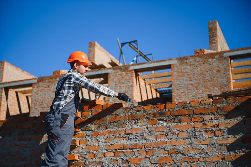 Construction Mason Worker Bricklayer Installing Red Brick with Trowel ...