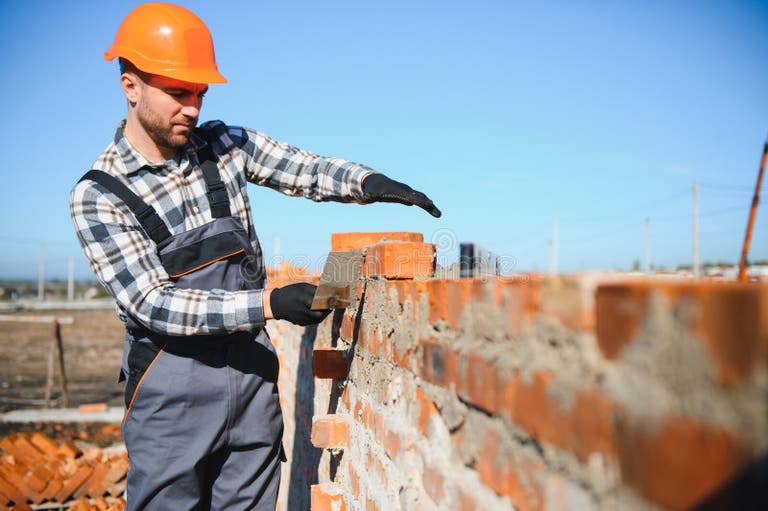Construction Mason Worker Bricklayer Installing Red Brick with Trowel ...