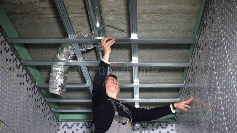Construction Master Man Attach Aluminum Ceiling Profiles in New House ...