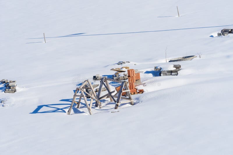 Construction Material on Building Site Under Snow in Winter Stock Photo ...