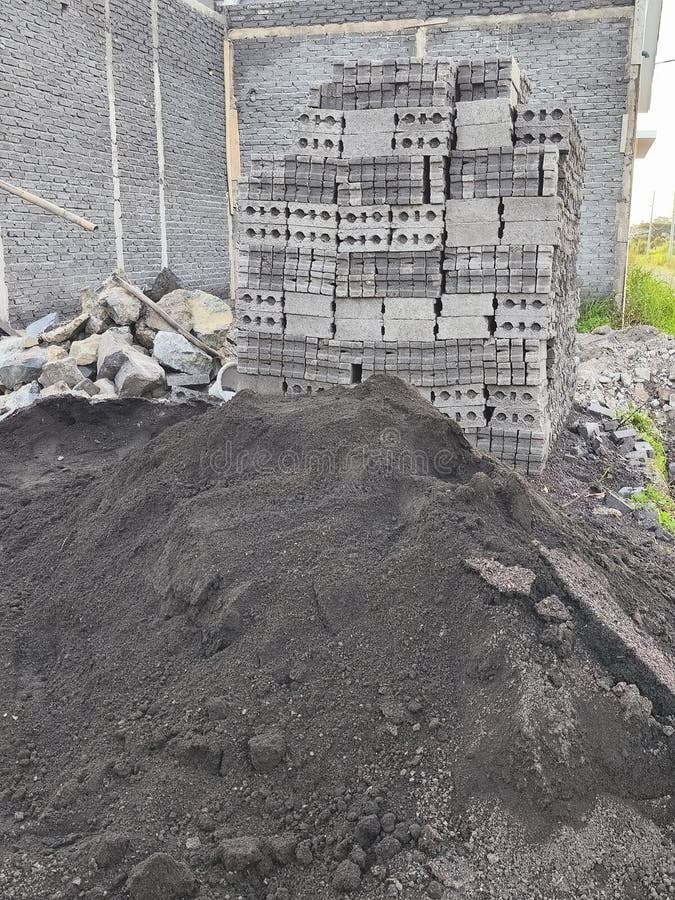 Construction Materials: Sand Pile and Concrete Blocks at a Building ...