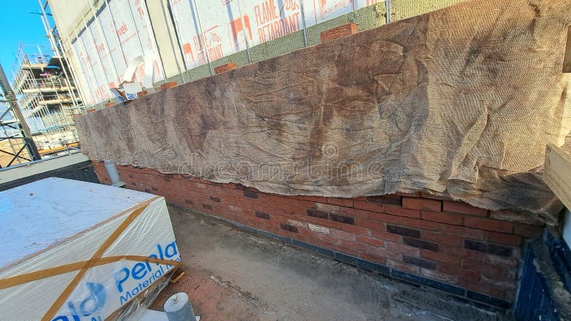 Construction Materials Stored on the Roof of Construction Building ...