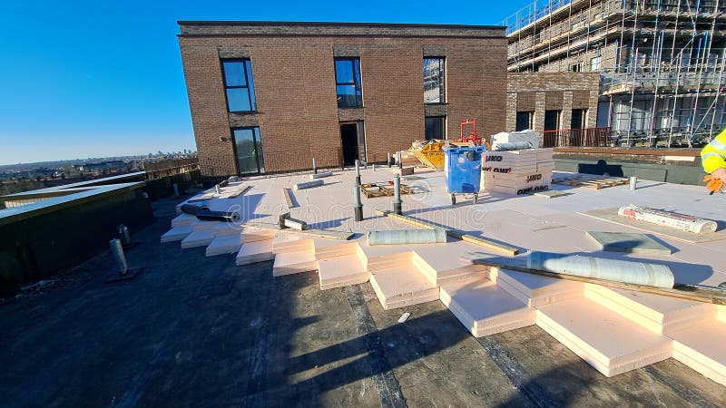 Construction Materials Stored on the Roof of Construction Building ...