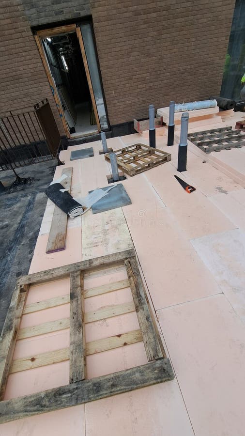 Construction Materials Stored on the Roof of Construction Building ...