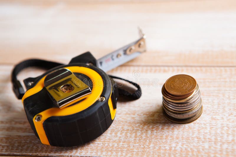 Construction Measuring Tape and Coins Stock Image - Image of instrument ...