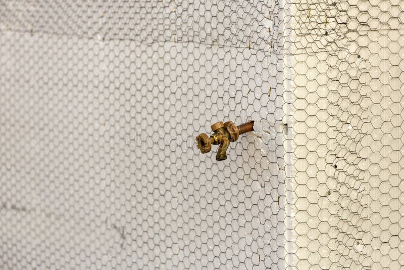 Construction Mesh Stretched Over Foam Near a Corner on a Wall with a ...