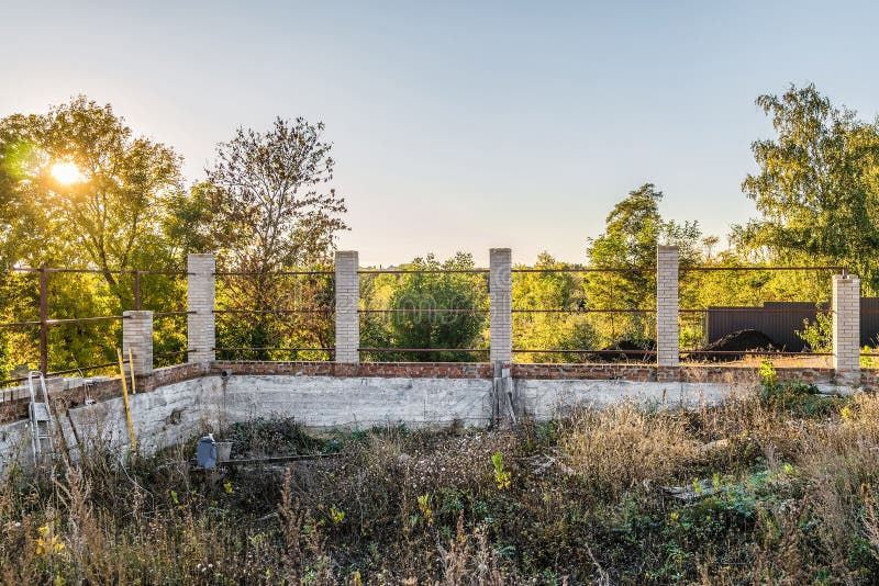 Construction of a Metal Frame Fence with Brick Posts Stock Image ...