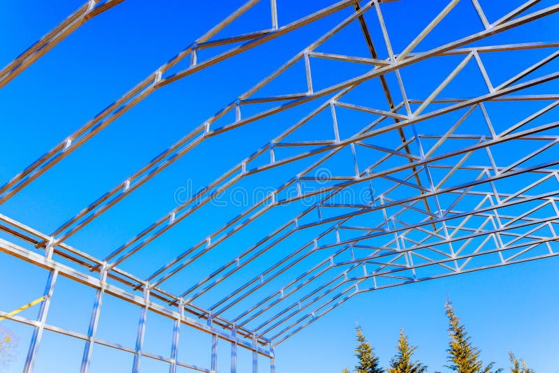 Construction of a Metal Frame Structure Under a Clear Blue Sky in a ...