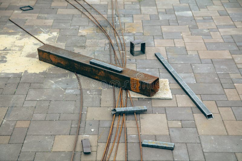 Construction Metal on Paving Slabs. Stock Image - Image of steel ...