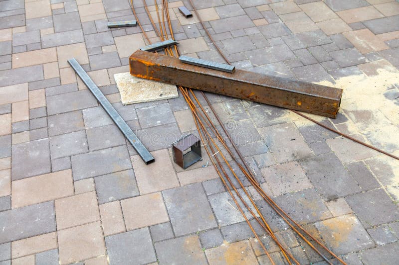Construction Metal on Paving Slabs. Stock Photo - Image of material ...