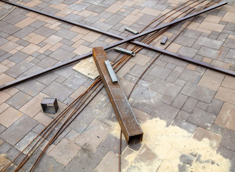 Construction Metal on Paving Slabs. Stock Photo - Image of wall ...