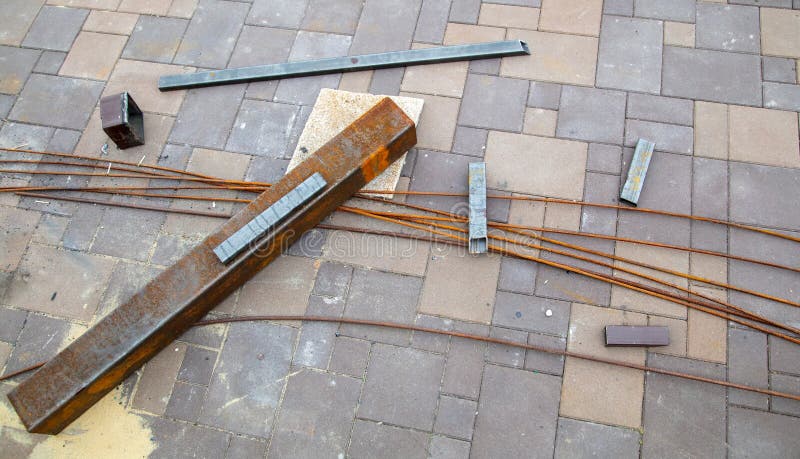 Construction Metal on Paving Slabs. Stock Photo - Image of curbs ...