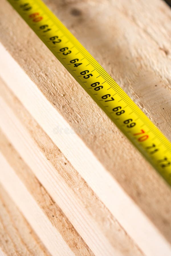 Construction Meter on the Pile of Wooden Planks Stock Photo - Image of ...