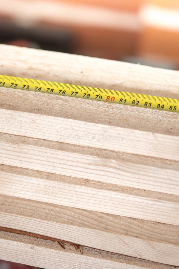 Construction Meter on the Pile of Wooden Planks Stock Image - Image of ...