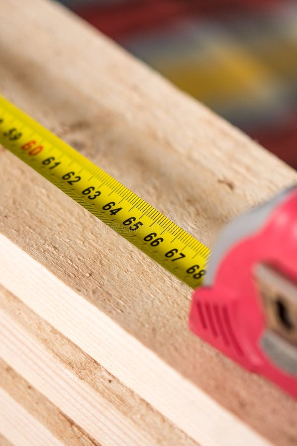Construction Meter on the Pile of Wooden Planks Stock Photo - Image of ...