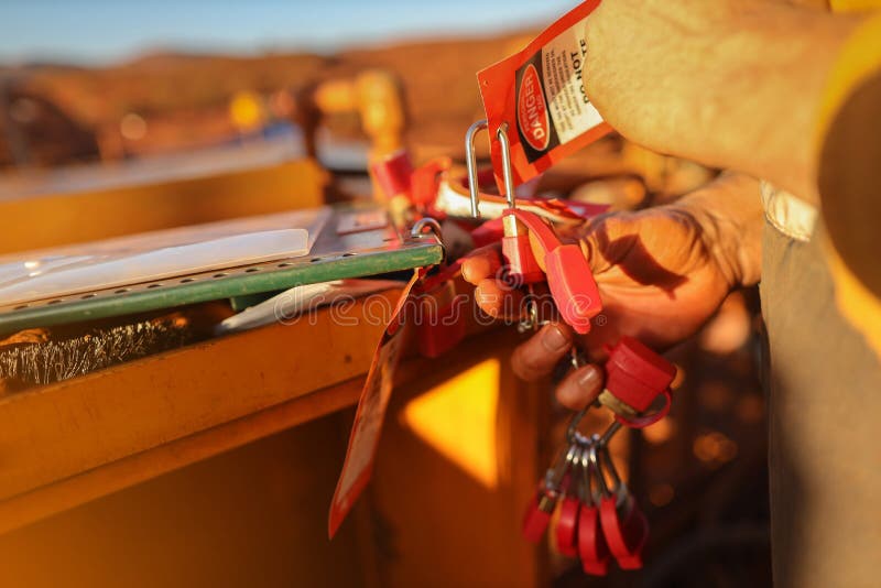 Construction Miner Placing Personal Red Danger Lock Which is Attached ...