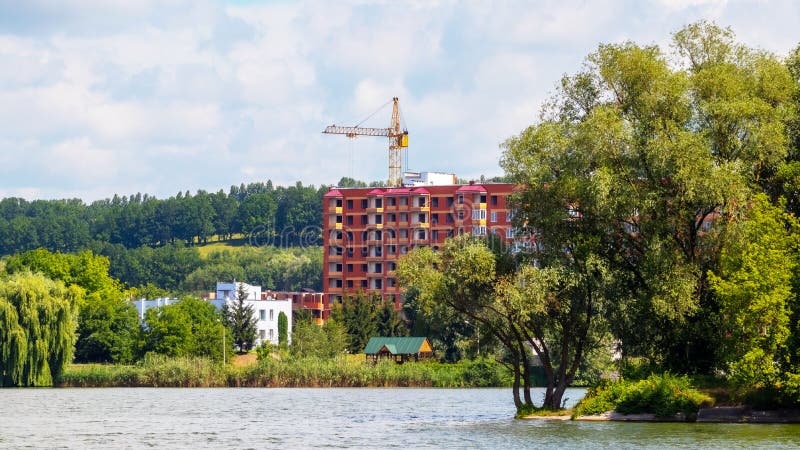 Construction of a Modern High-rise Building by the River Stock Image ...