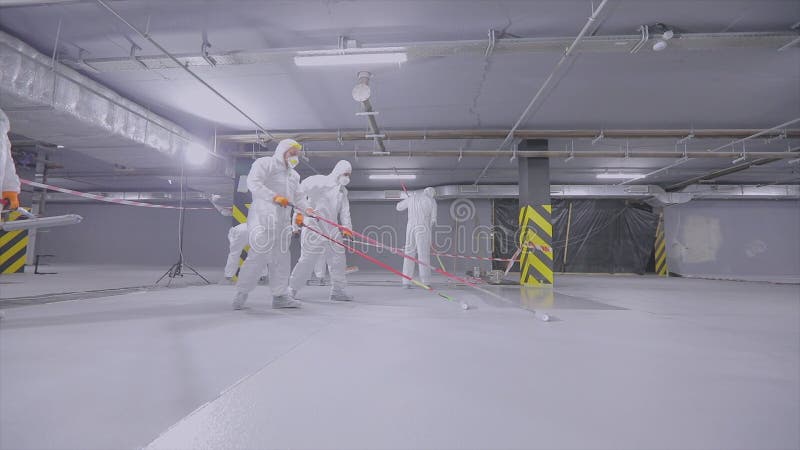 Construction of a Modern Parking Lot. Polymer Floor. Builders are ...