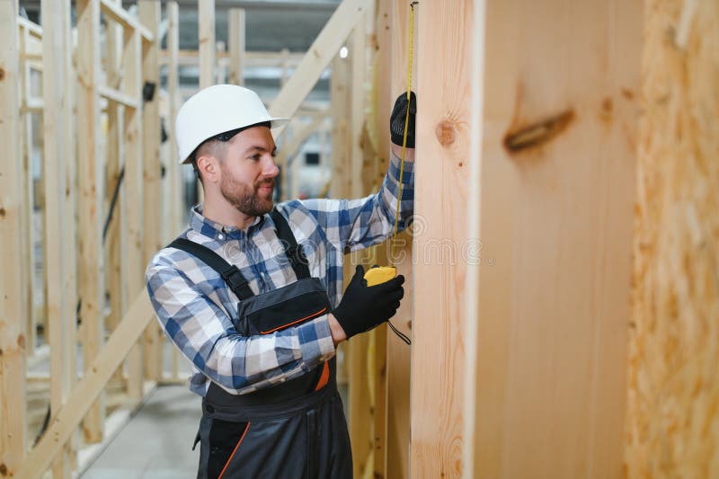 Construction of Modular Houses. a Carpenter or Builder Builds a Wooden House Stock Photo - Image ...