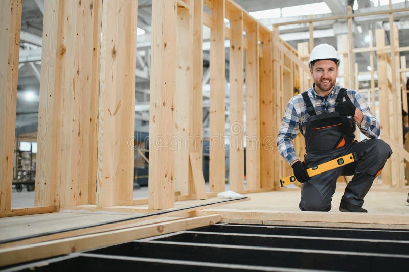 Construction of Modular Houses. a Carpenter or Builder Builds a Wooden ...