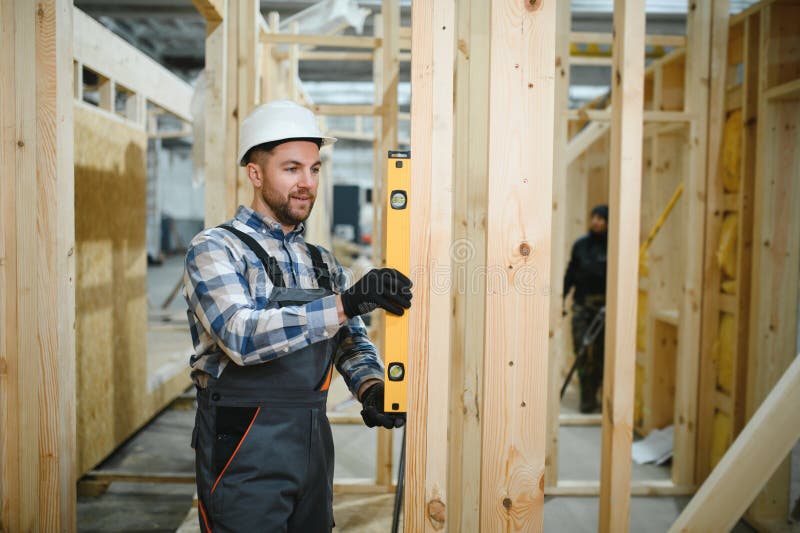 Construction of Modular Houses. a Carpenter or Builder Builds a Wooden ...