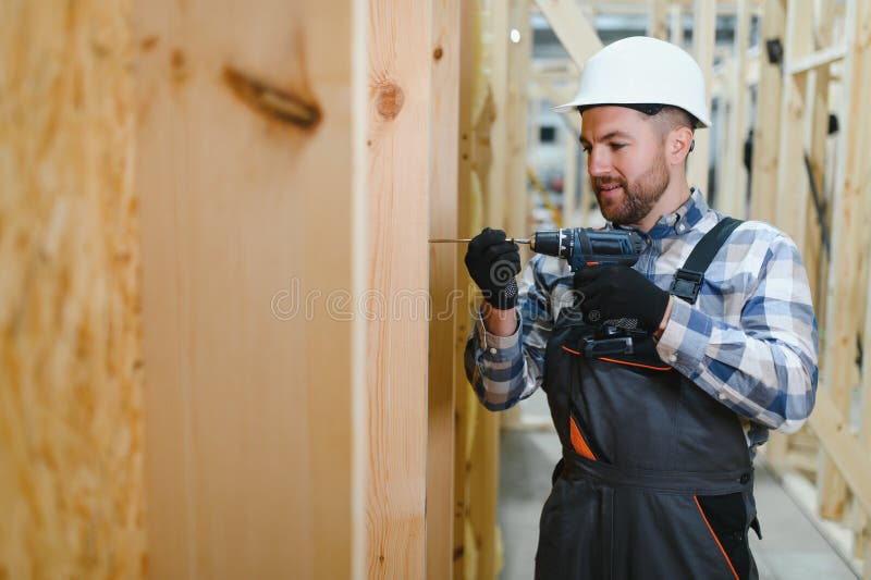 Construction of Modular Houses. a Carpenter or Builder Builds a Wooden ...