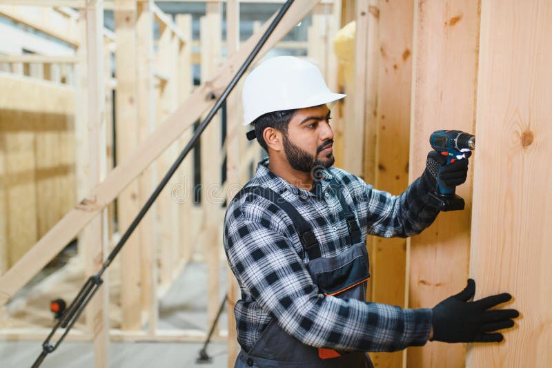 Construction of Modular Houses. Indian Construction Worker or Engineer ...