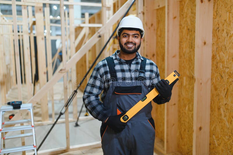 Construction of Modular Houses. Indian Construction Worker or Engineer ...