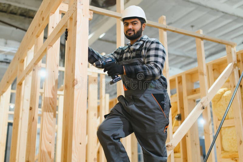 Construction of Modular Houses. Indian Construction Worker or Engineer ...