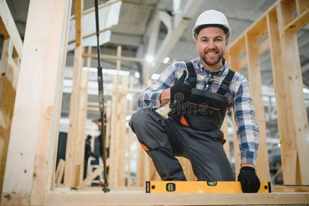 Construction of Modular Houses. Male Construction Worker in Uniform and ...