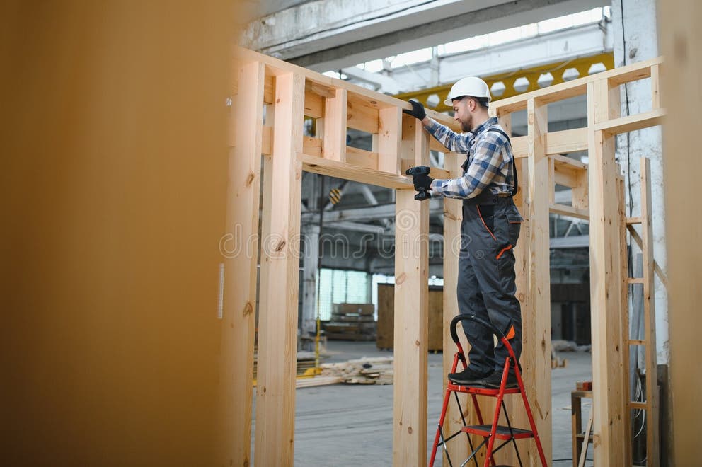 Construction of Modular Houses. Male Construction Worker in Uniform and ...