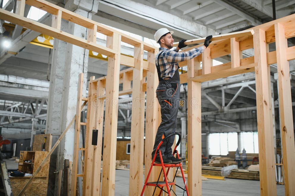 Construction of Modular Houses. Male Construction Worker in Uniform and ...