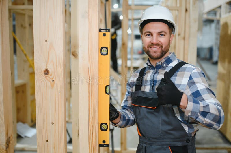 Construction of Modular Houses. Male Construction Worker in Uniform and ...