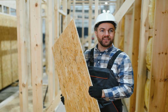 Construction of Modular Houses. Male Construction Worker in Uniform and ...