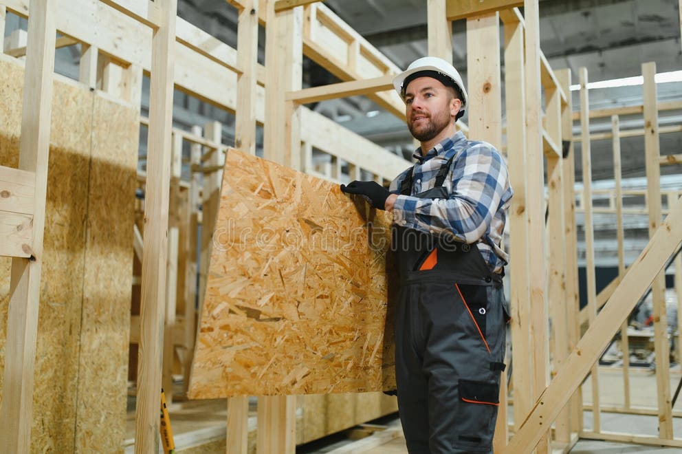 Construction of Modular Houses. Male Construction Worker in Uniform and ...