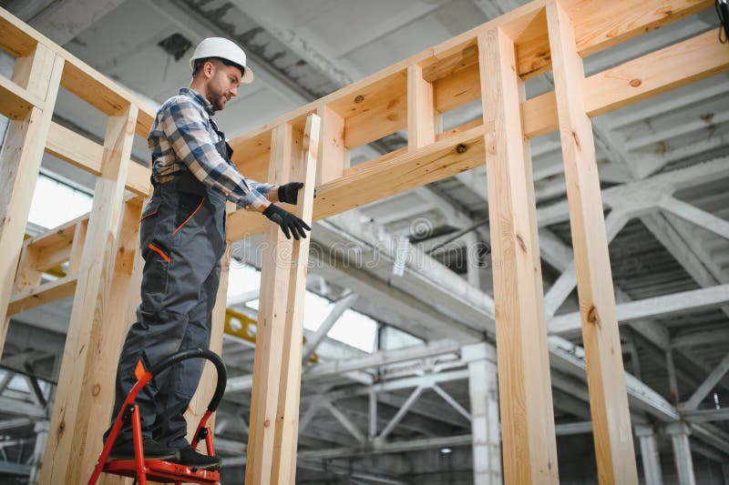 Construction of Modular Houses. Male Construction Worker in Uniform and ...