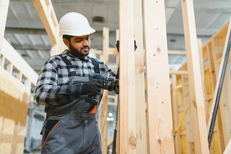 Construction of Modular Houses. Male Indian Construction Worker in ...