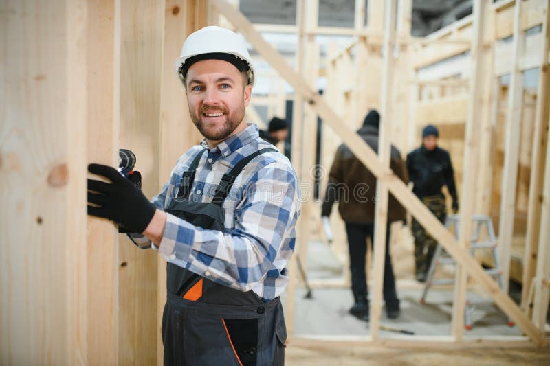 Construction of Modular Houses. Male Construction Worker in Uniform and ...
