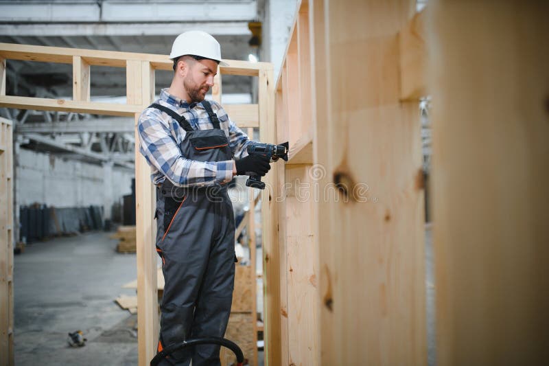 Construction of Modular Houses. Male Construction Worker in Uniform and ...