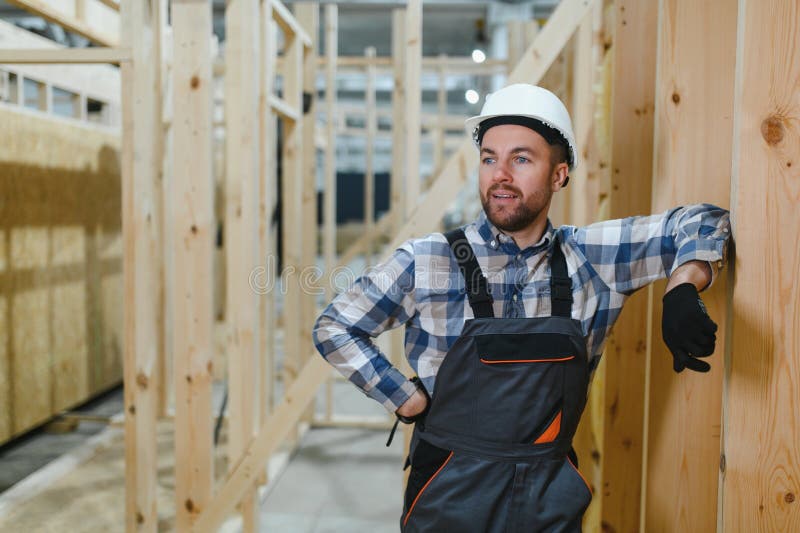 Construction of Modular Houses. Male Construction Worker in Uniform and ...