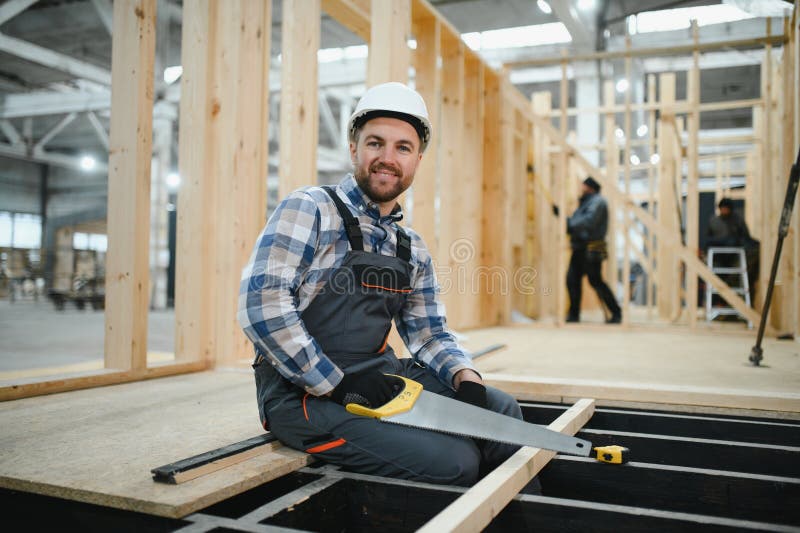 Construction of Modular Houses. Male Construction Worker in Uniform and ...