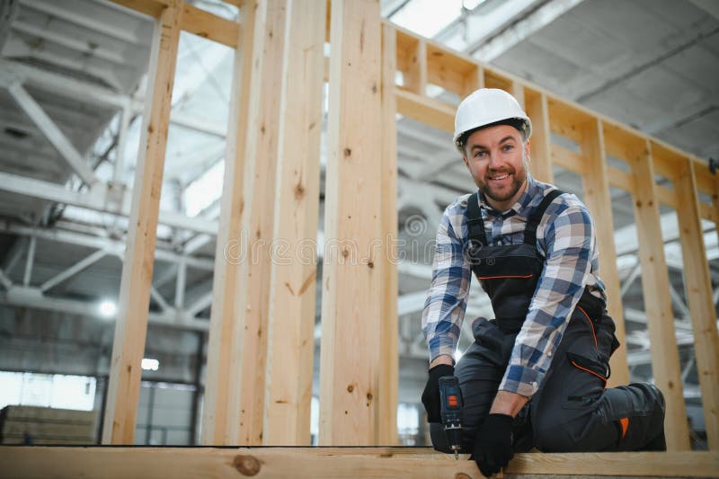 Construction of Modular Houses. Male Construction Worker in Uniform and ...