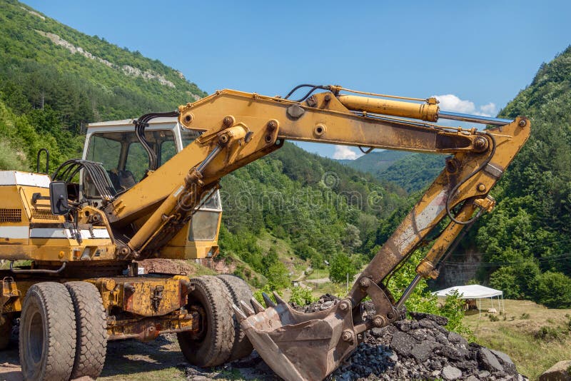 Construction in the Mountains Stock Photo - Image of digger, nature ...