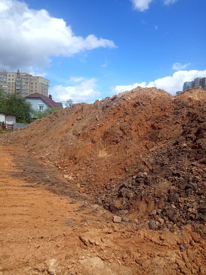 Construction of a Multi-storey Building,large Pile of Sand and Clay ...