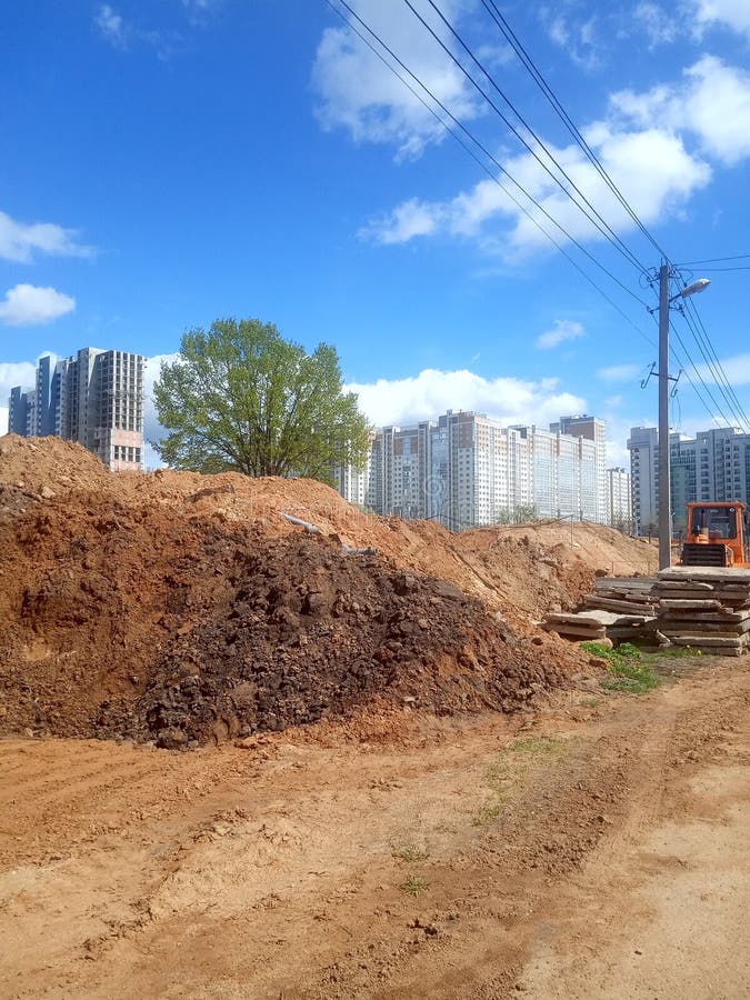 Construction of a Multi-storey Building,large Pile of Sand and Clay ...