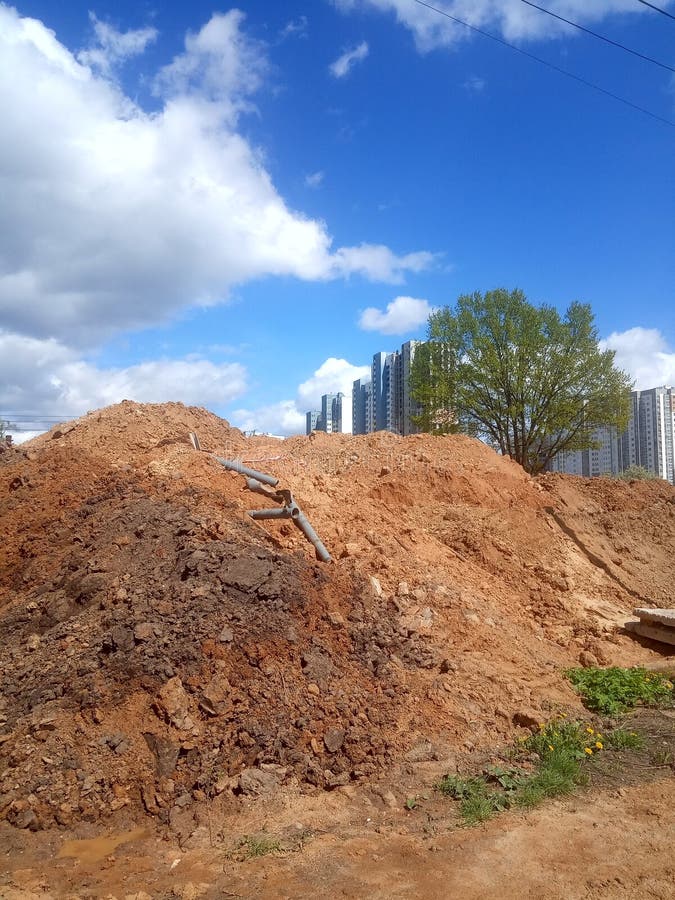 Construction of a Multi-storey Building,large Pile of Sand and Clay ...